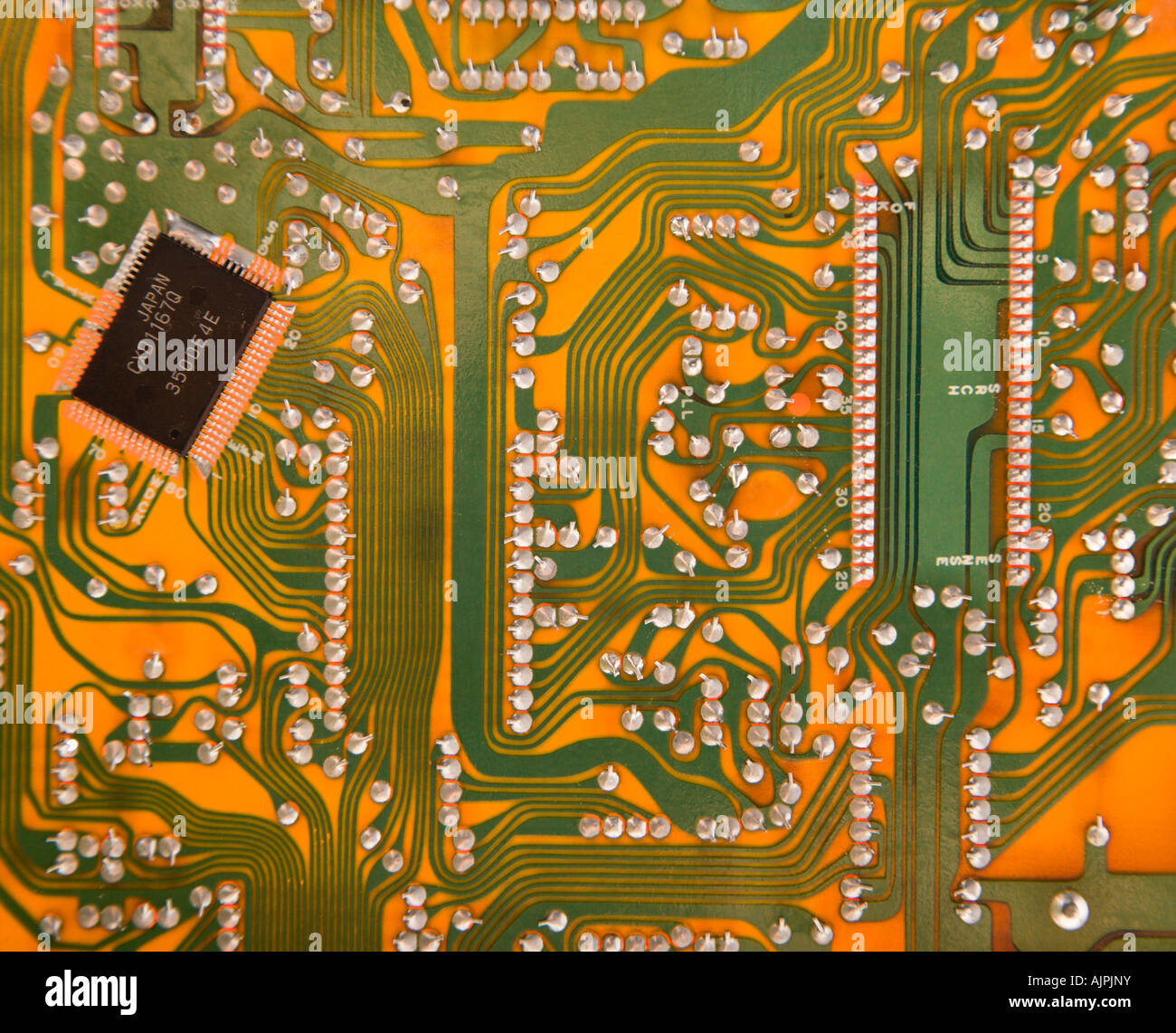 Orange circuit board detail Stock Photo - Alamy