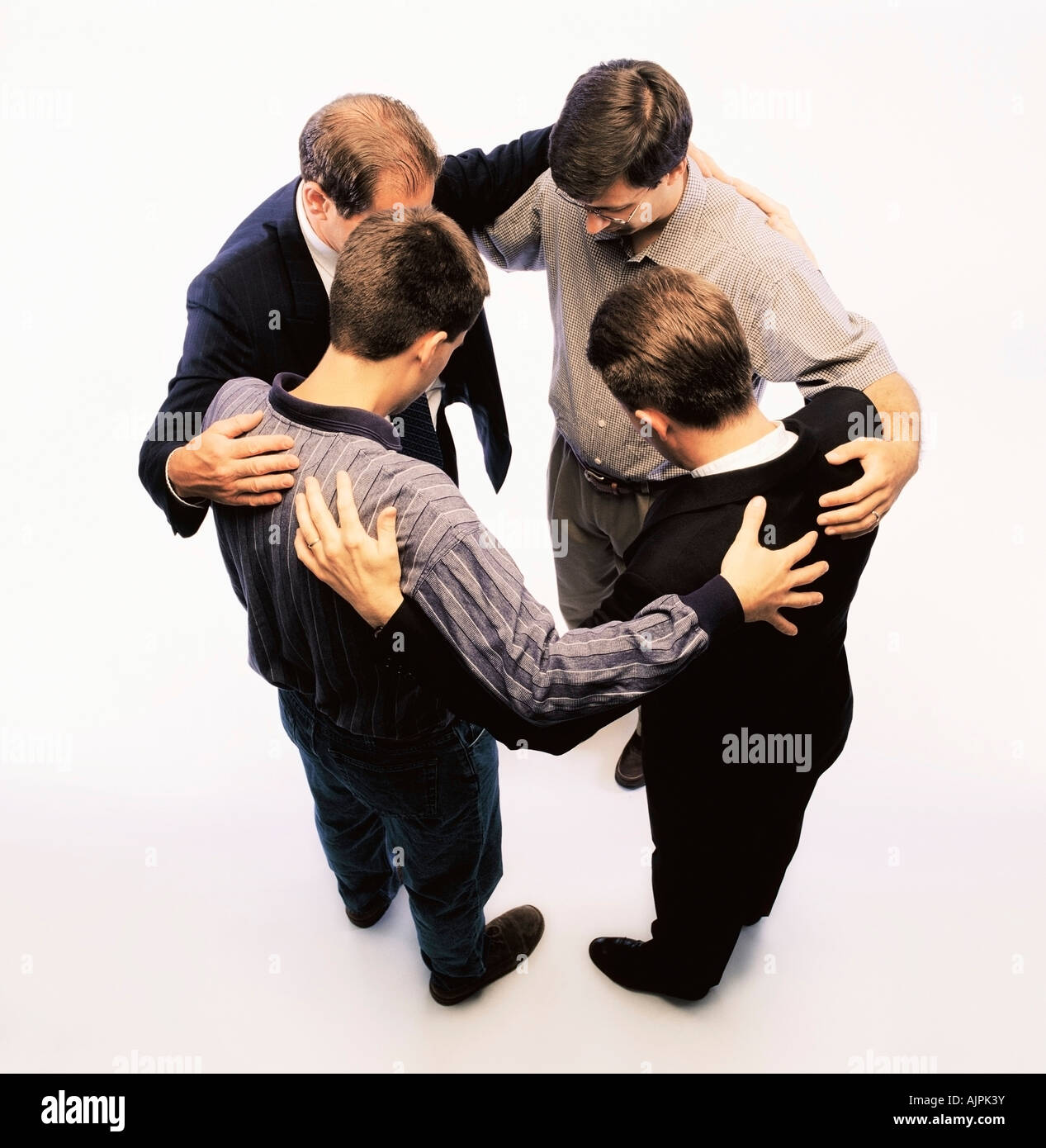 Group business people praying together hi-res stock photography and ...