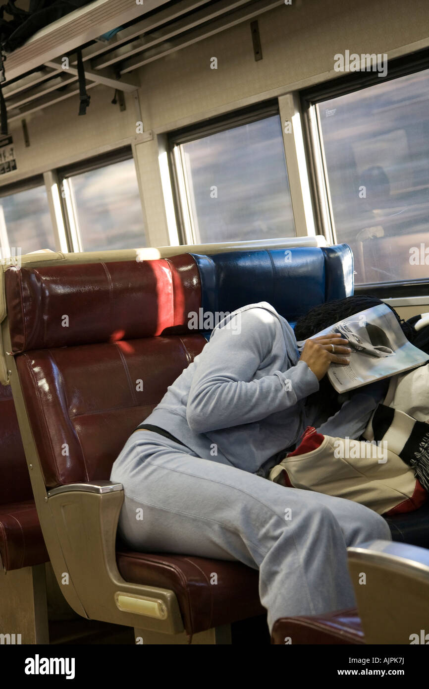 Girl sleeping on train hi-res stock photography and images - Alamy