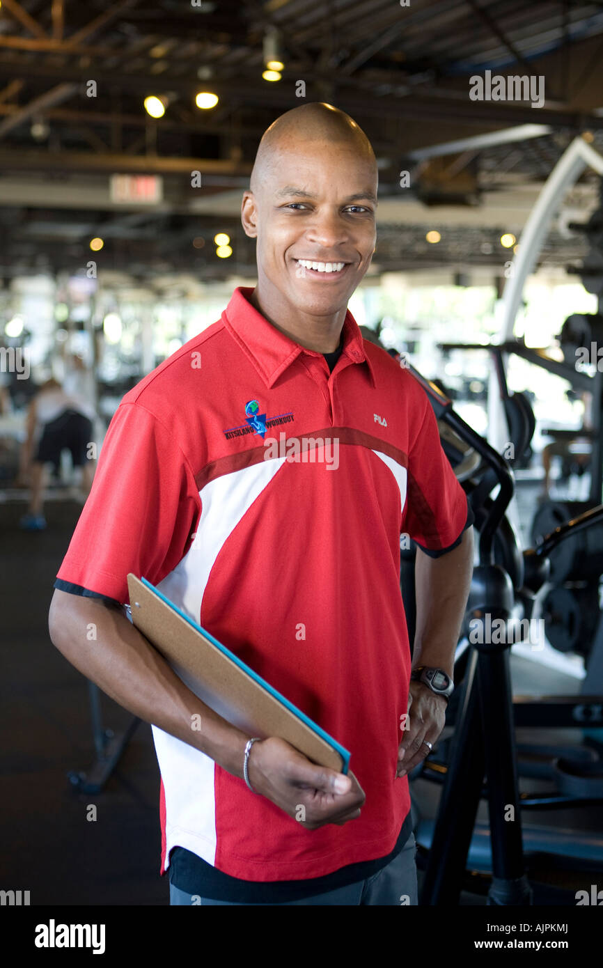 fitness personal trainer posing in a gym Stock Photo - Alamy