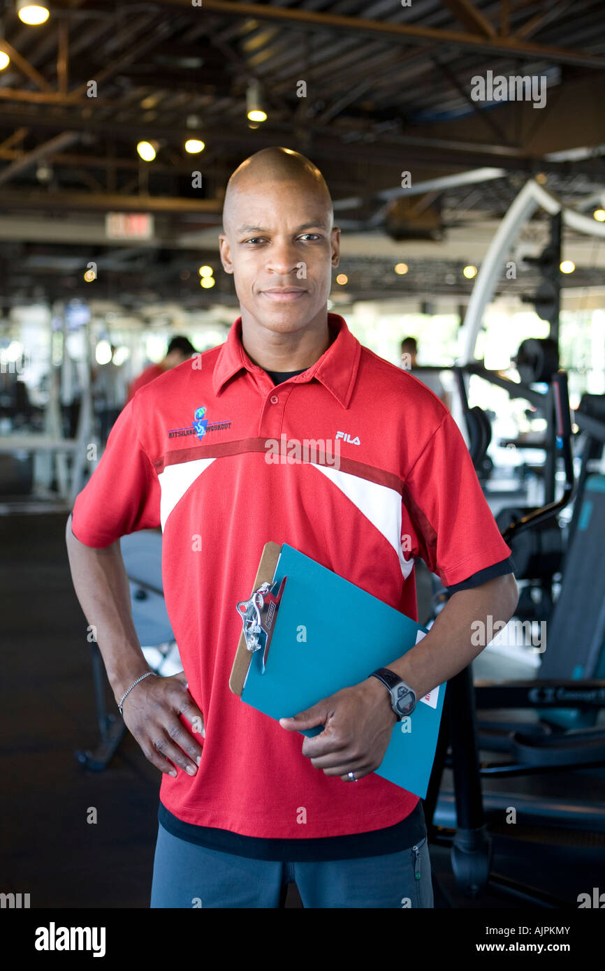 fitness personal trainer posing in a gym Stock Photo - Alamy