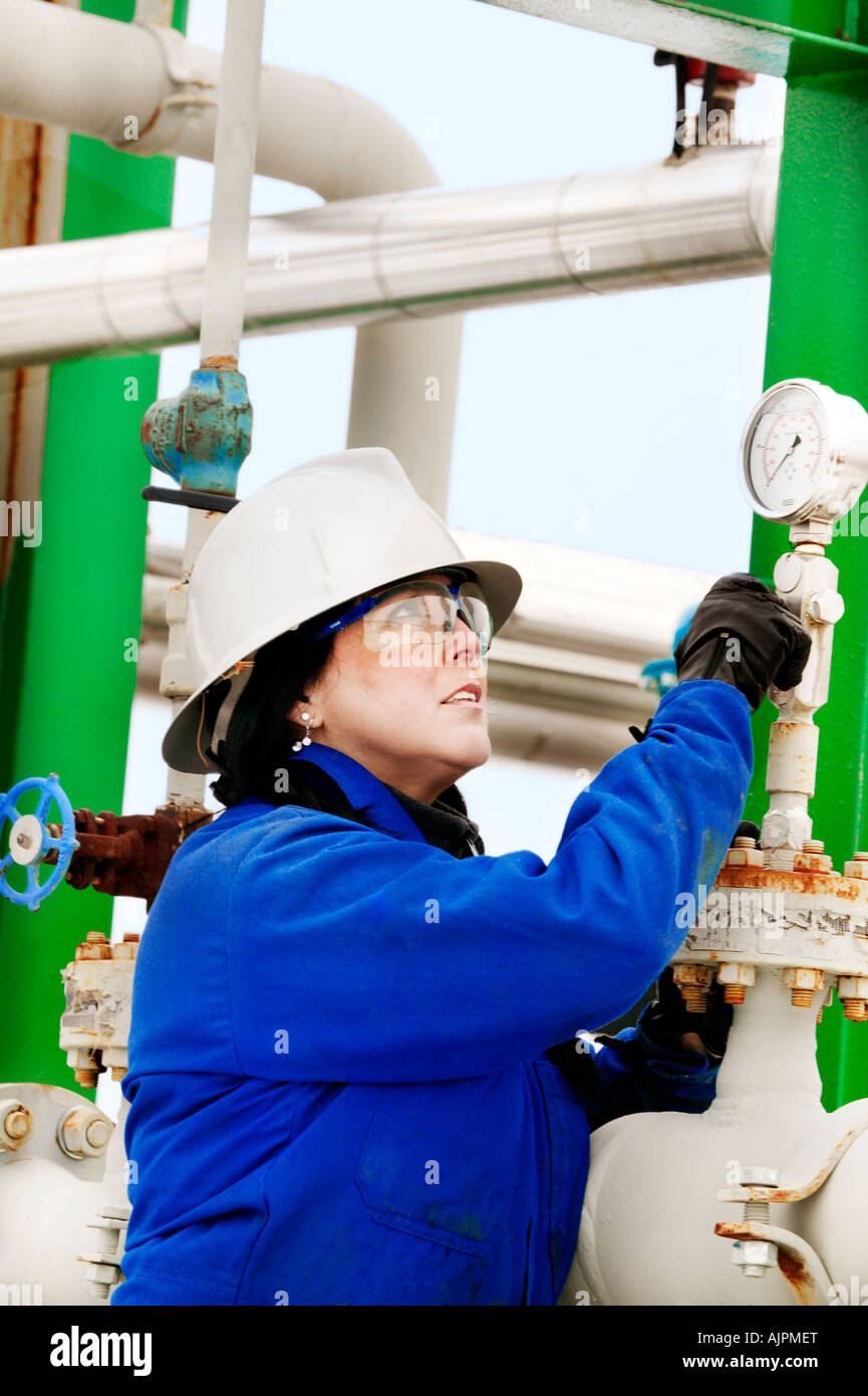 Woman working in a boiler room Stock Photo - Alamy