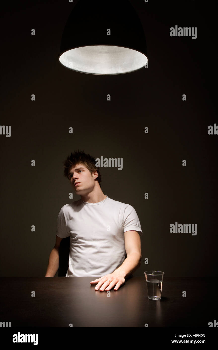 Young man being interrogated Stock Photo - Alamy