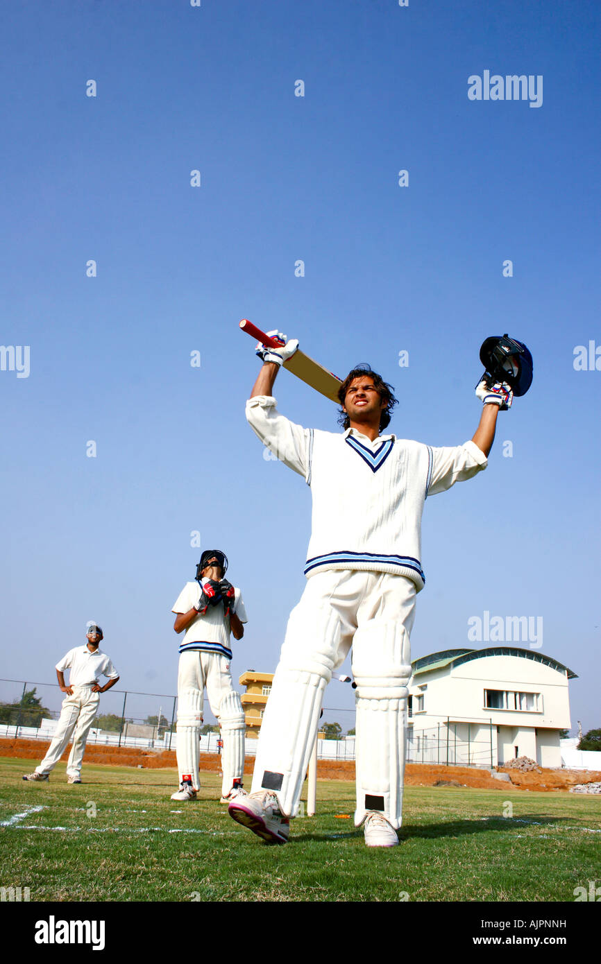 Cricket batsman raising bat hi-res stock photography and images - Alamy