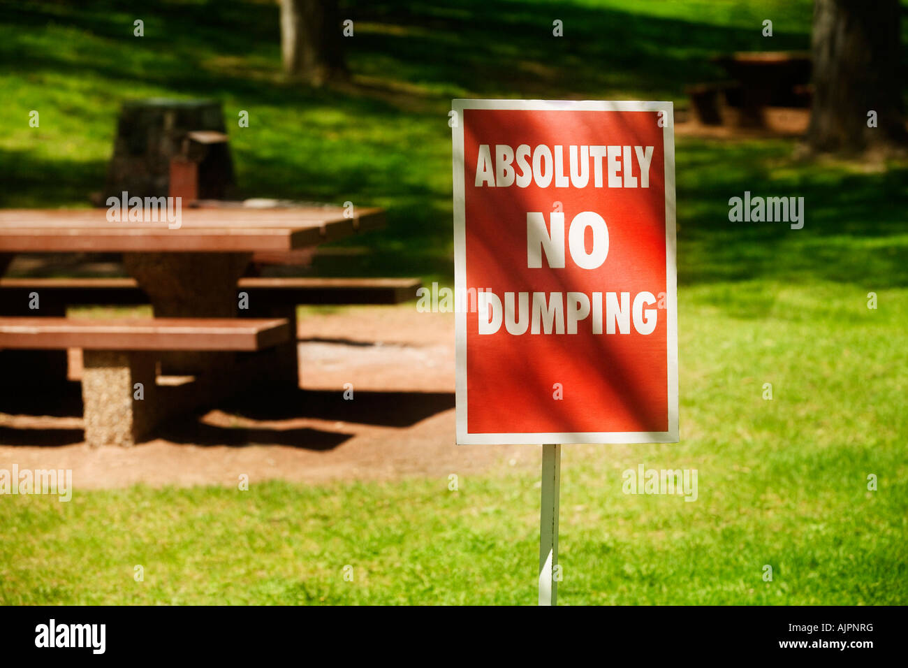 No dumping sign in the park Stock Photo - Alamy
