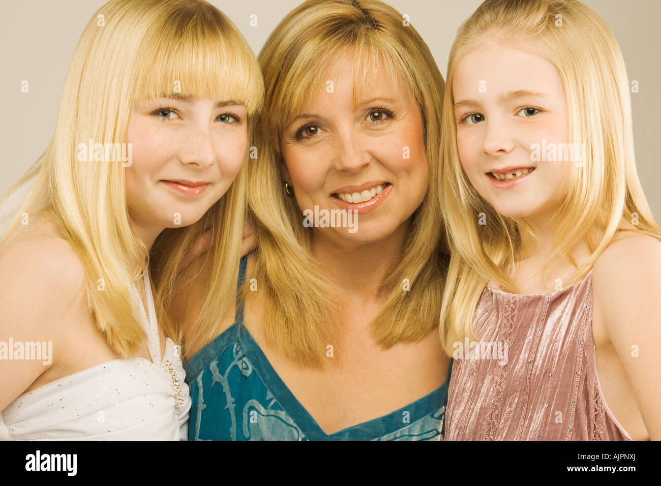 Mother with two daughters Stock Photo - Alamy
