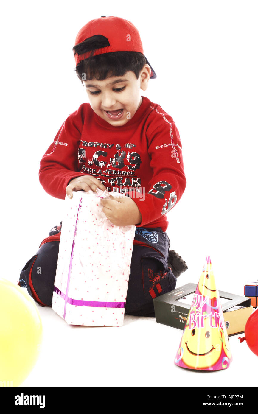 Boy opening present indian hi-res stock photography and images - Alamy