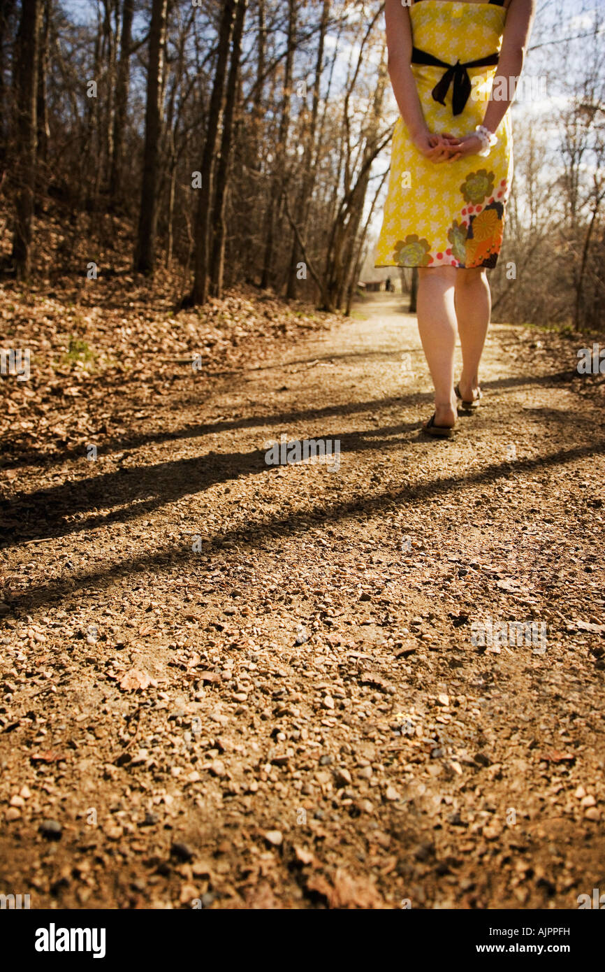 Female walking down a path Stock Photo - Alamy