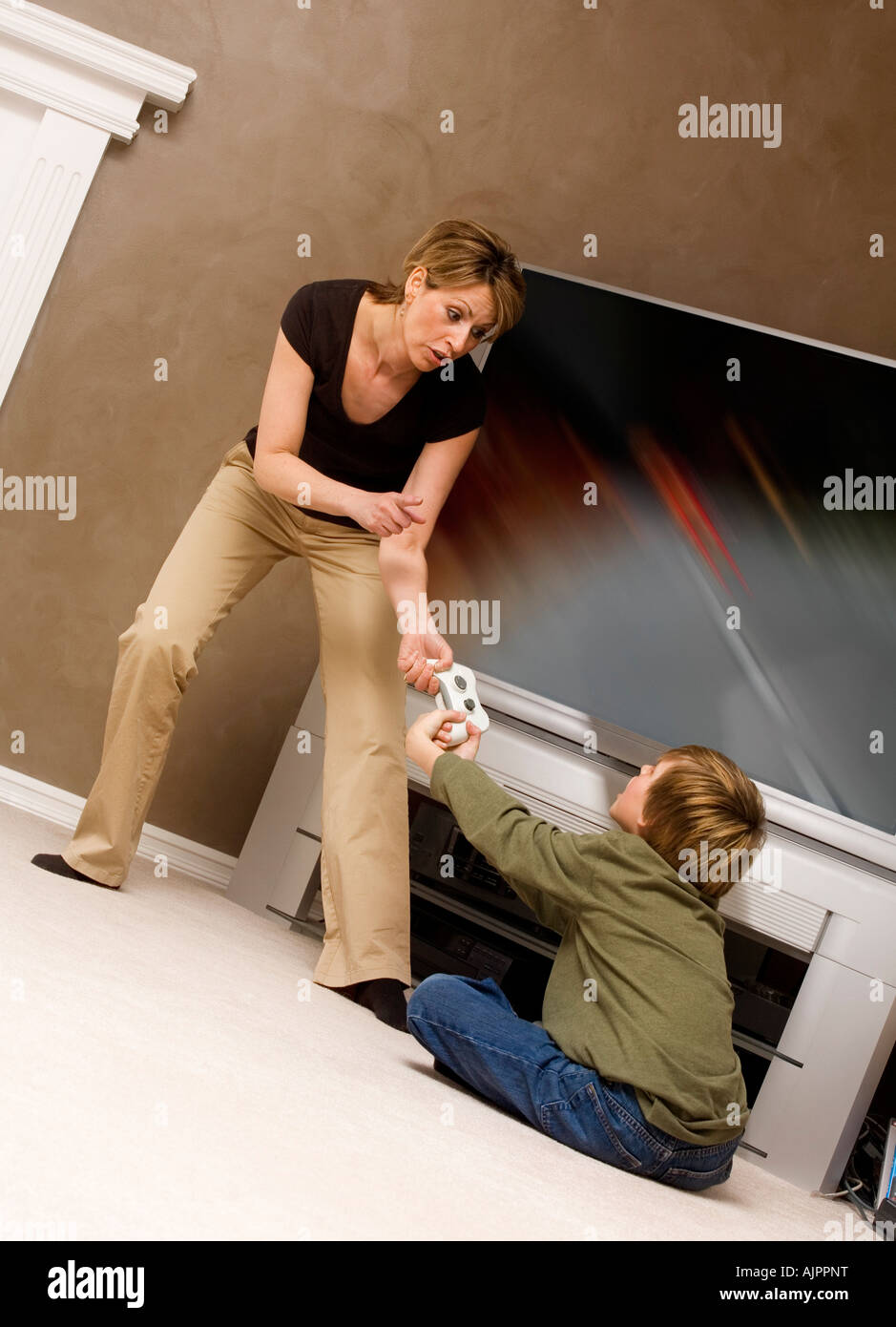 Mother putting restrictions on her son Stock Photo - Alamy