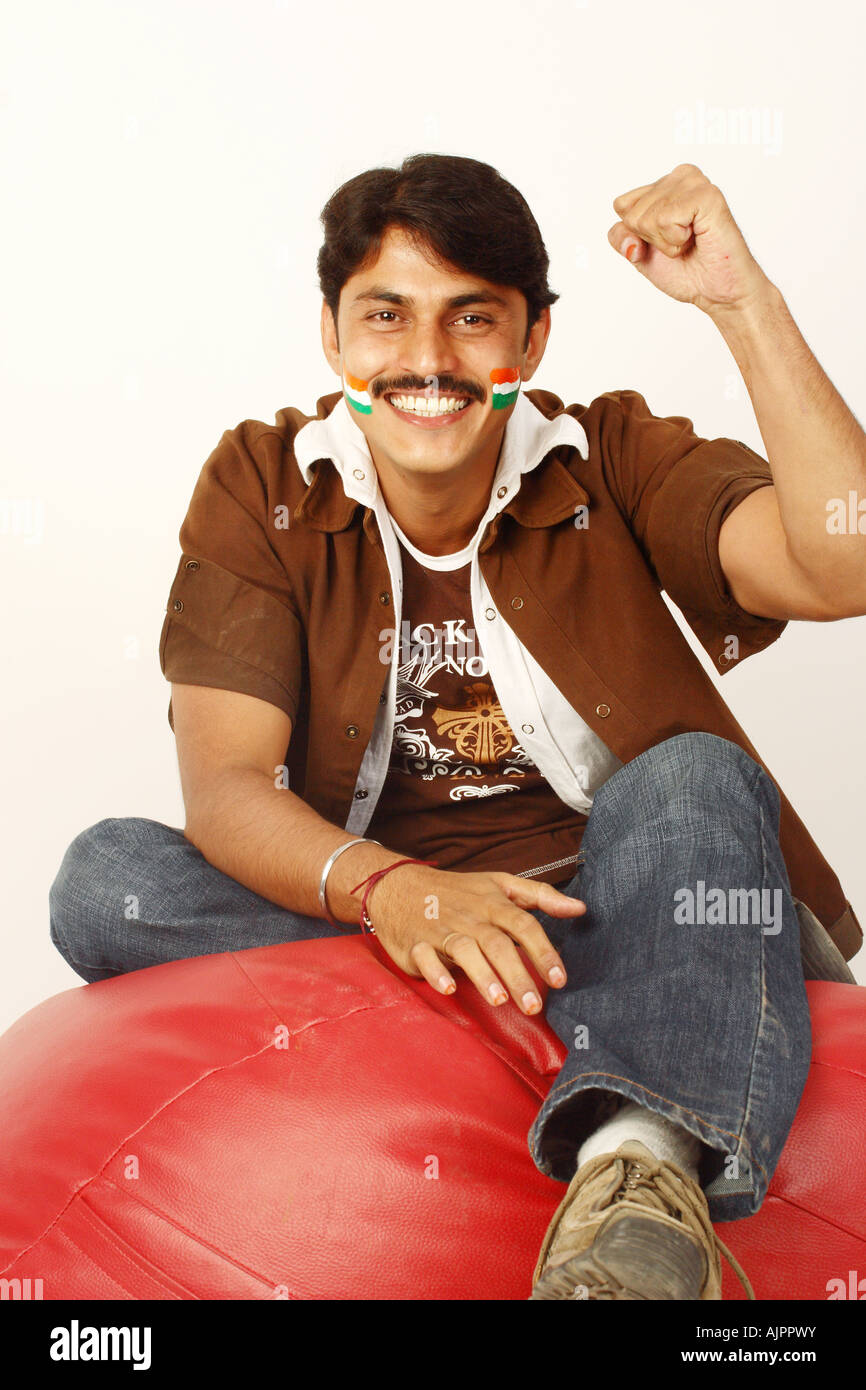 A cricket fan cheering for his team Stock Photo - Alamy