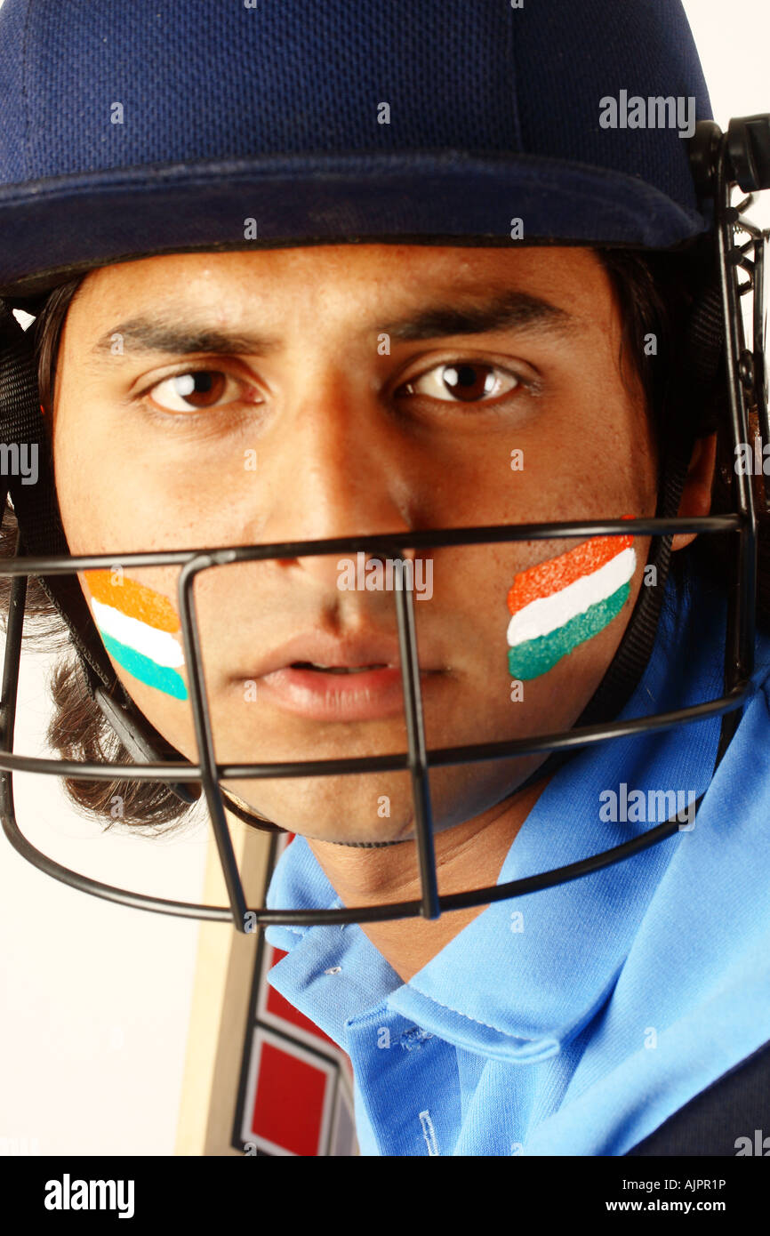 Close up of a cricketer wearing a helmet Stock Photo - Alamy