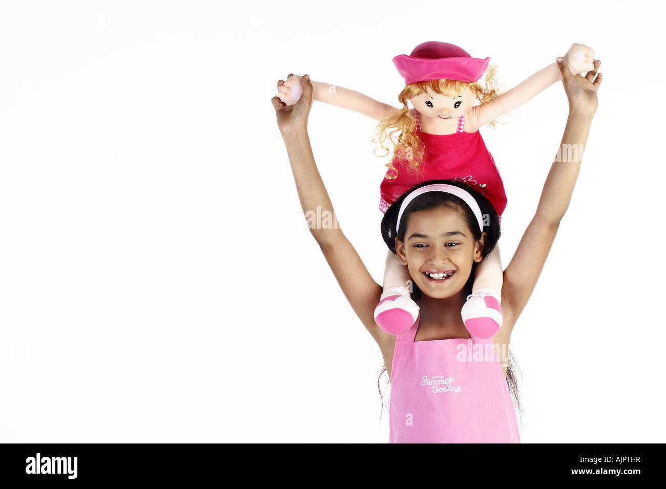 A young girl with a doll Stock Photo - Alamy