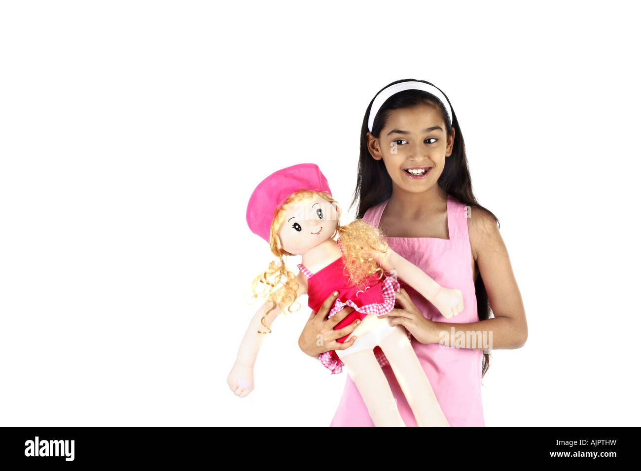 A young girl with a doll Stock Photo - Alamy