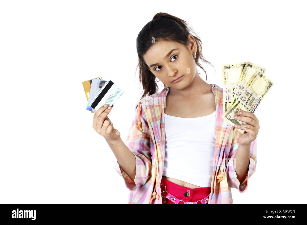 A girl holding money and cards Stock Photo - Alamy