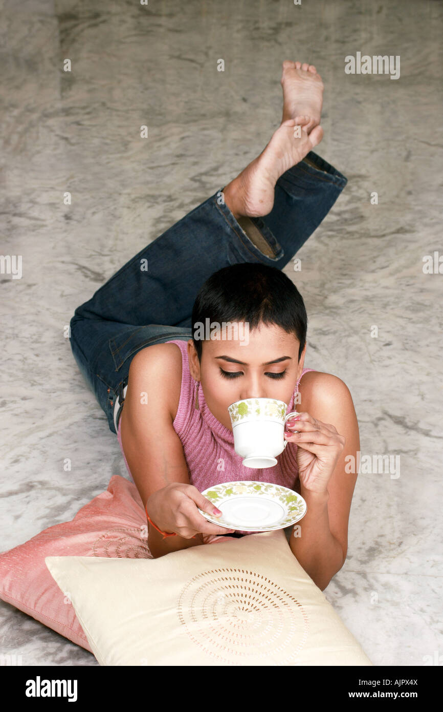 A woman drinking tea Stock Photo - Alamy