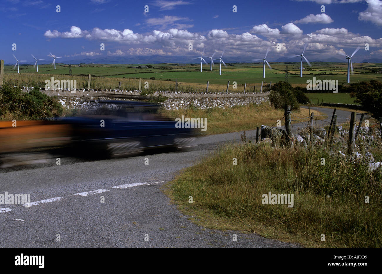 Wind farm and car Anglesey Wales UK Stock Photo - Alamy