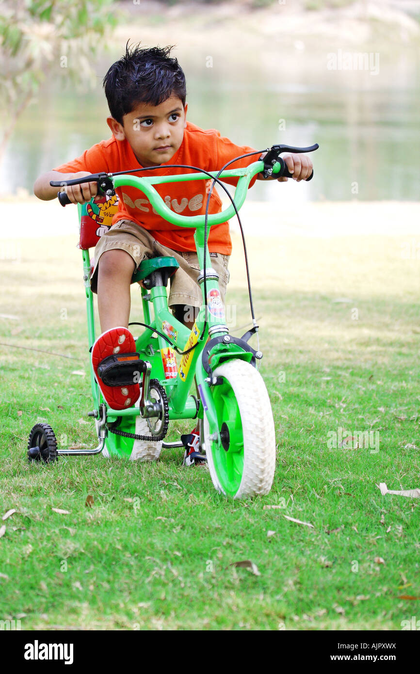 A young kid riding his cycle Stock Photo - Alamy