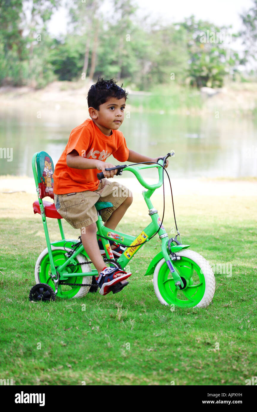 A young kid riding his cycle Stock Photo - Alamy