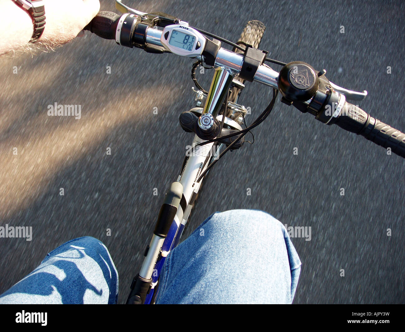 looking down at handle bars on a moving bike Stock Photo - Alamy