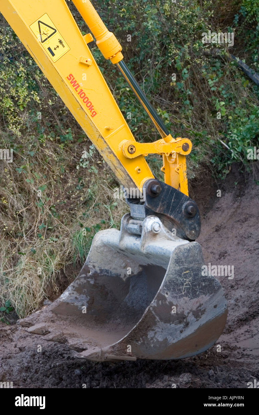 Excavator digging in mud Stock Photo - Alamy