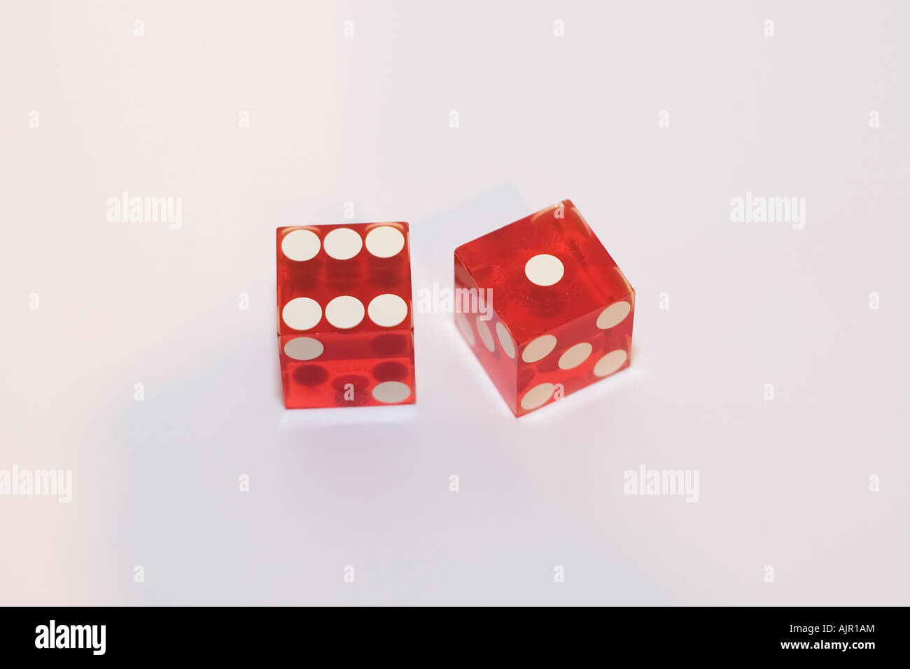 Two red dice Stock Photo - Alamy