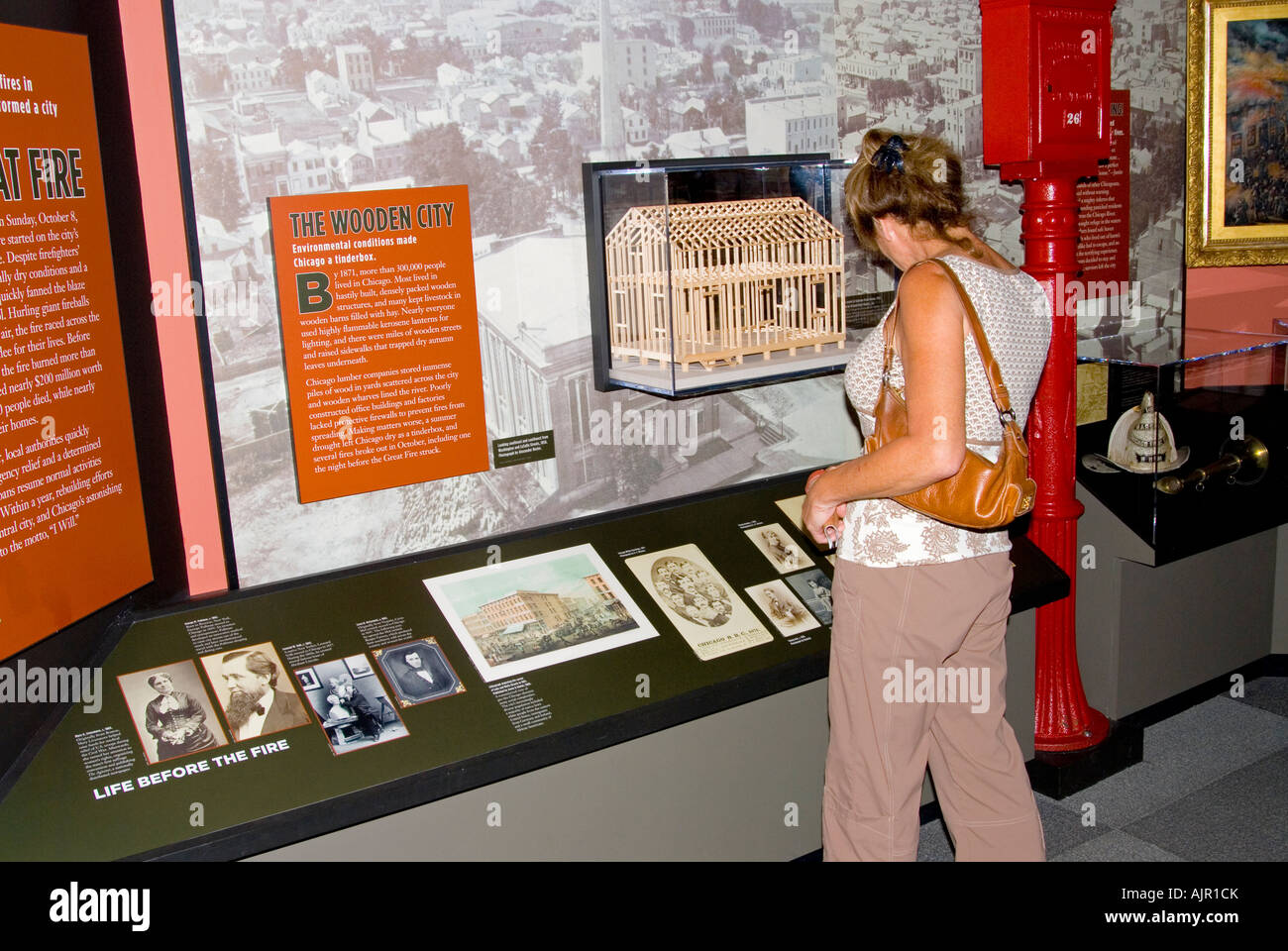Woman viewing exhibit at museum Stock Photo - Alamy