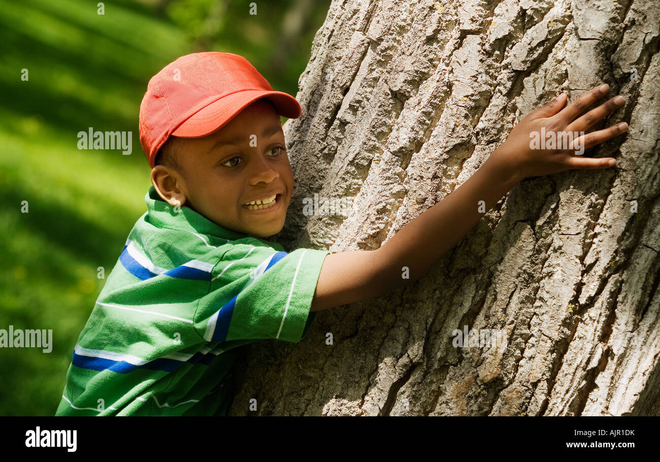 Boy Hugging Tree Trunk High Resolution Stock Photography and Images - Alamy
