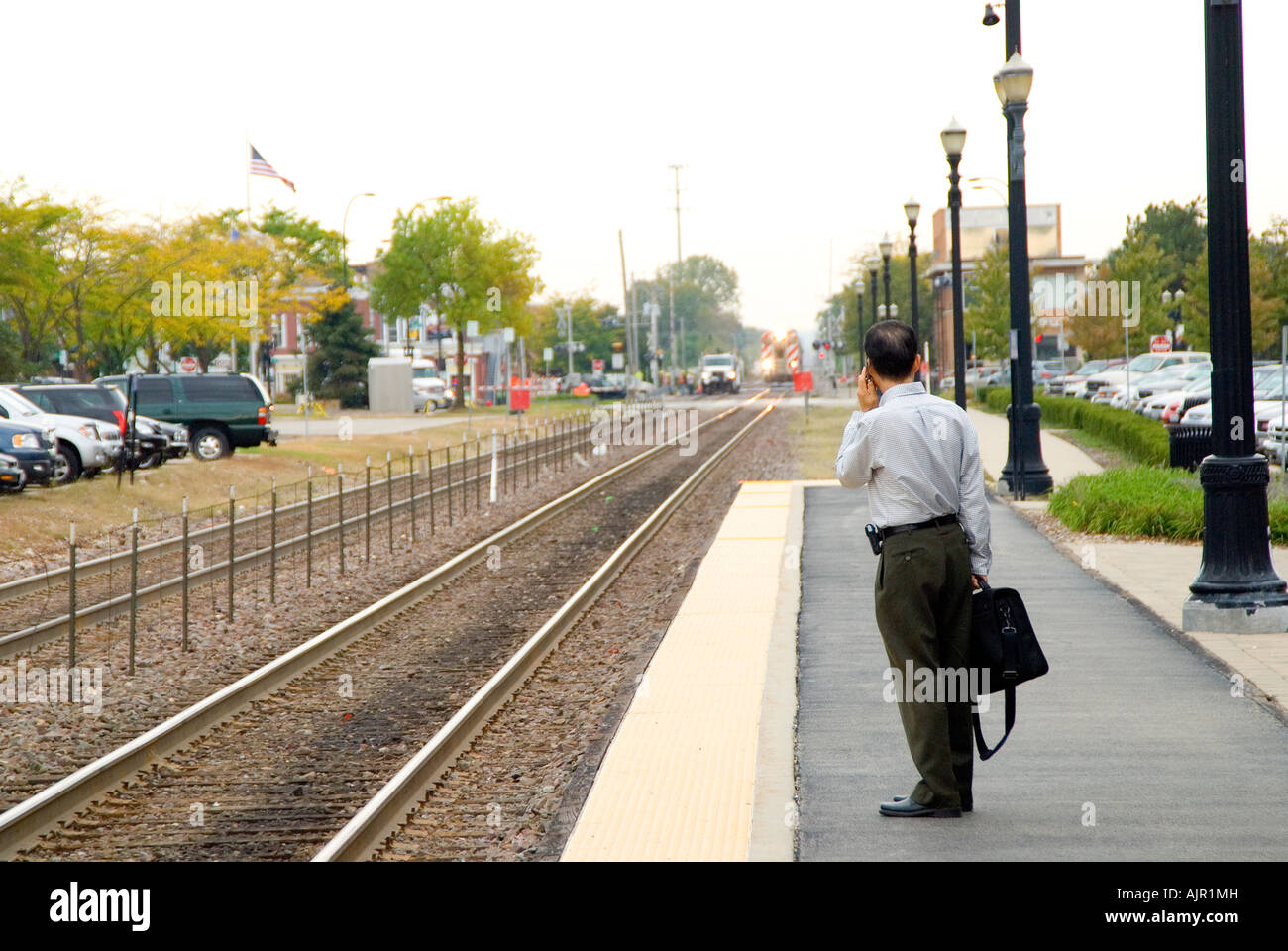 Man waiting for train Stock Photo - Alamy