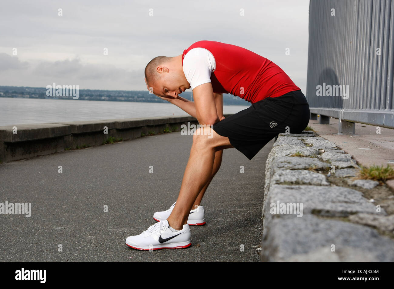 fit muscular hard body male personal trainer exercising outdoors Stock ...