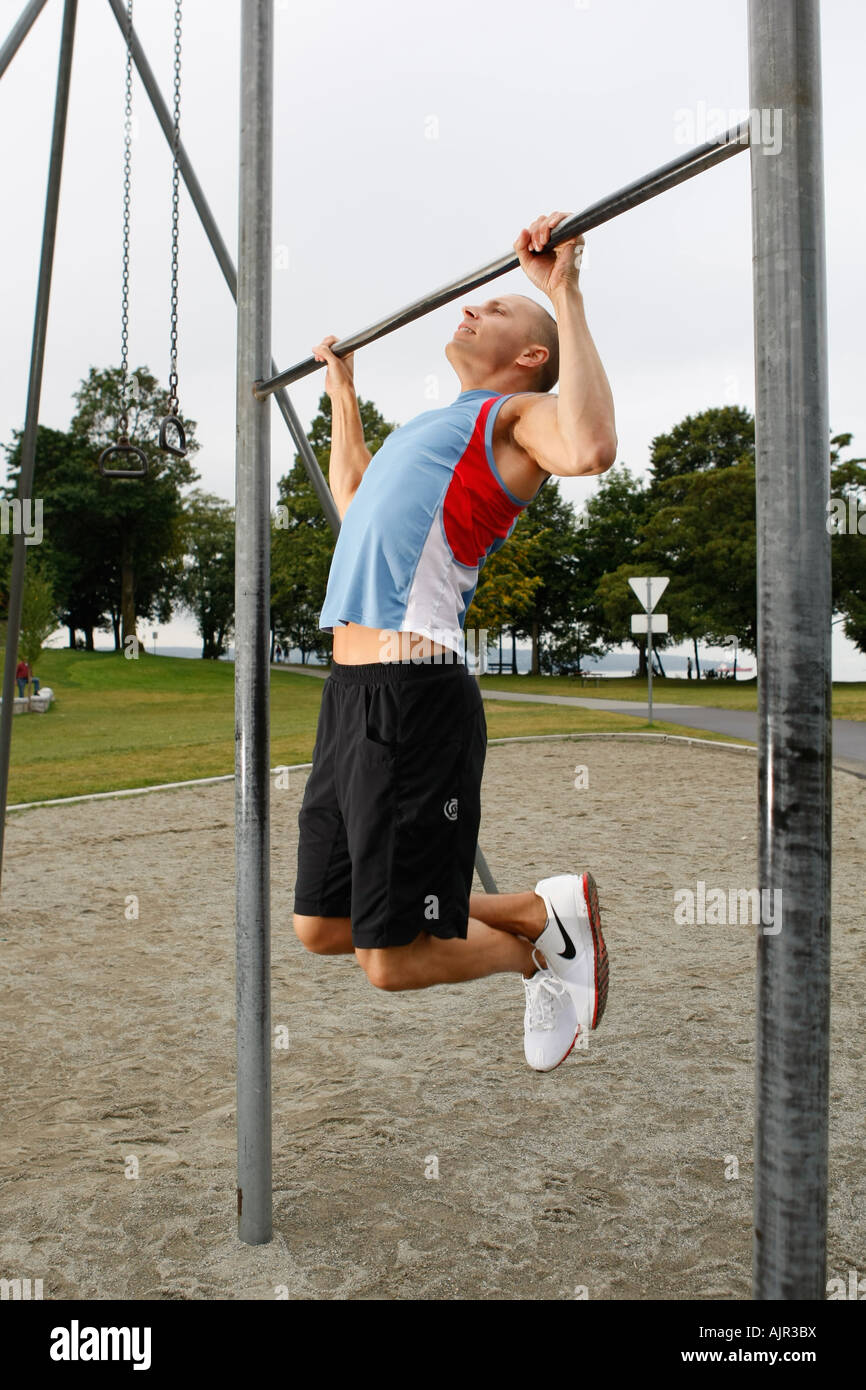 fit muscular hard body male personal trainer exercising outdoors Stock ...