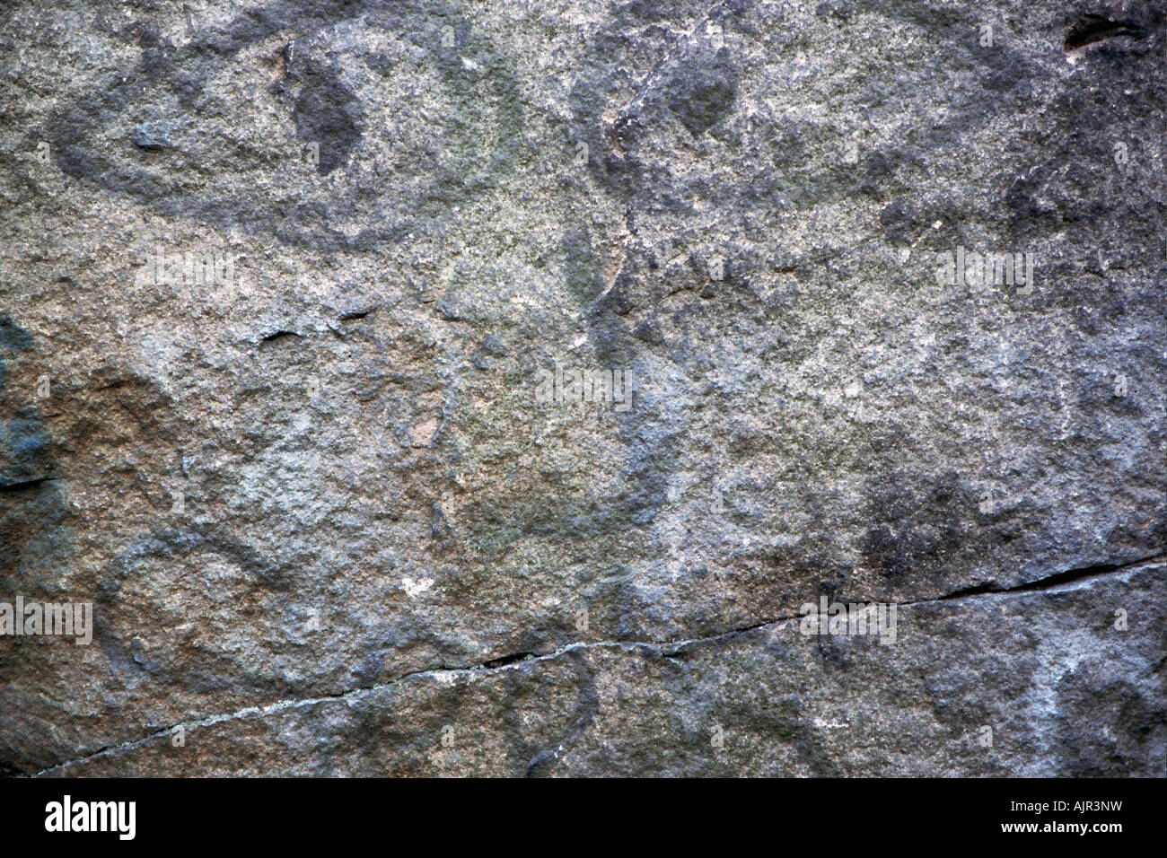 graffiti face on rock face Stock Photo - Alamy