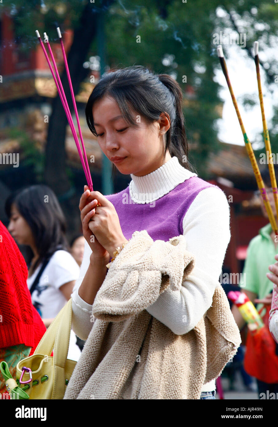 Woman praying at temple hi-res stock photography and images - Alamy