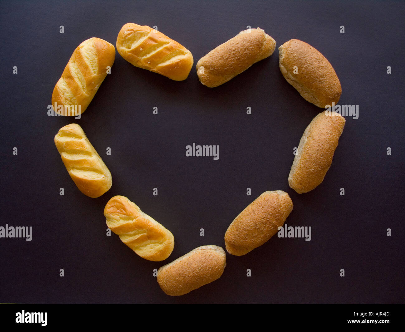 composition of different bread types - bun baguettes - arrangend in a ...
