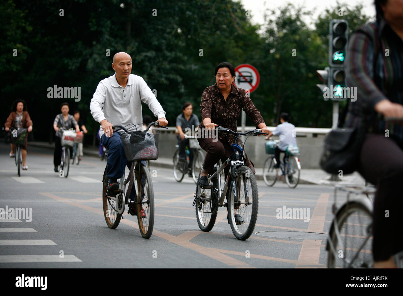 People riding bicycle Beijing China Stock Photo - Alamy