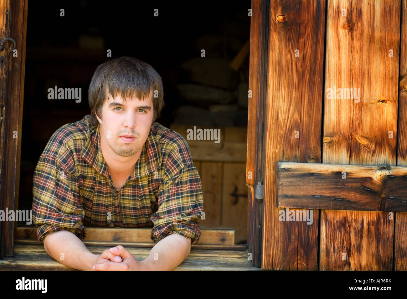 Front view of a man leaning in window Stock Photo - Alamy