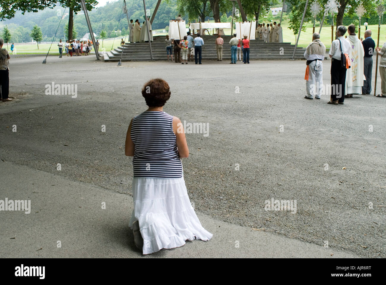 Single female pilgrim praying Stock Photo - Alamy