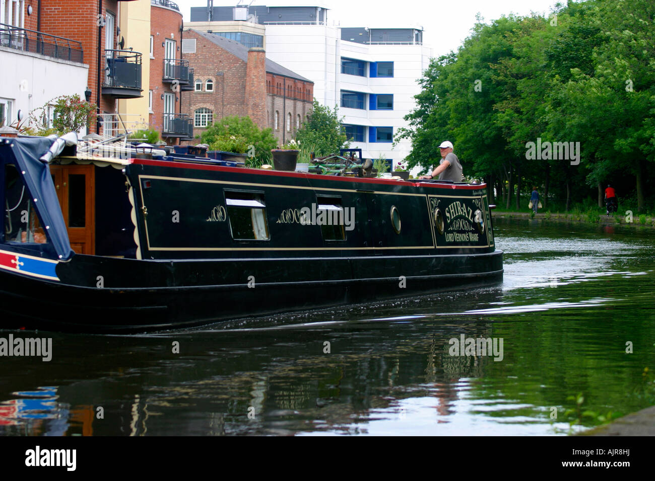 Nottingham Beeston canal, canal barge motoring towards castle lock ...