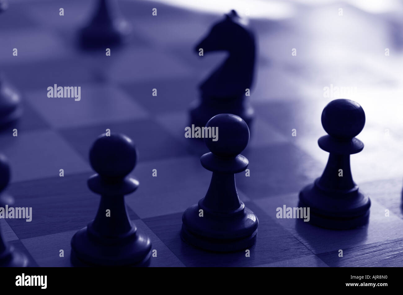 Chess pieces with shadows on a chess board Stock Photo - Alamy