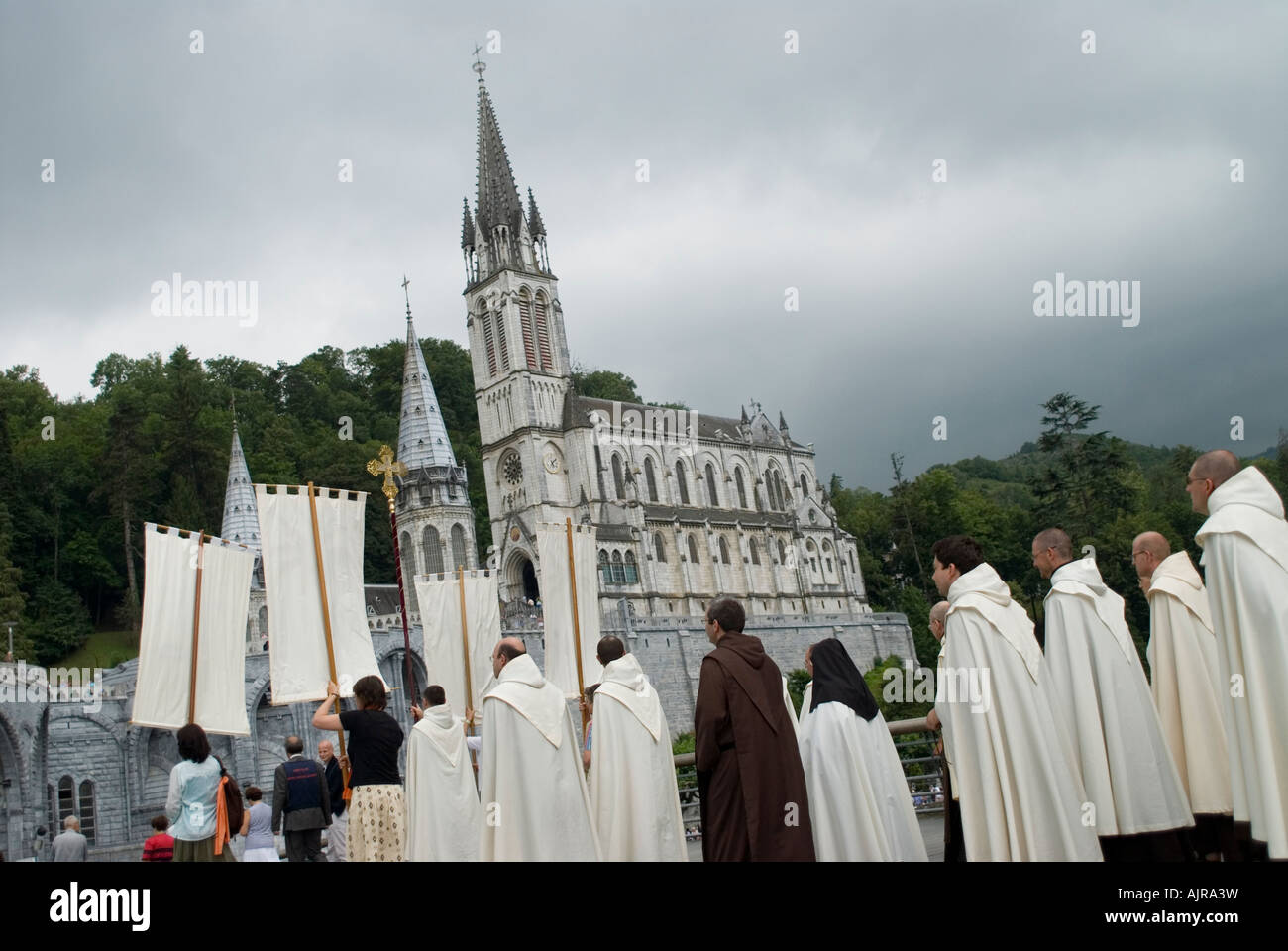 Monks praying in front of basilica of the immaculate conception, Notre ...