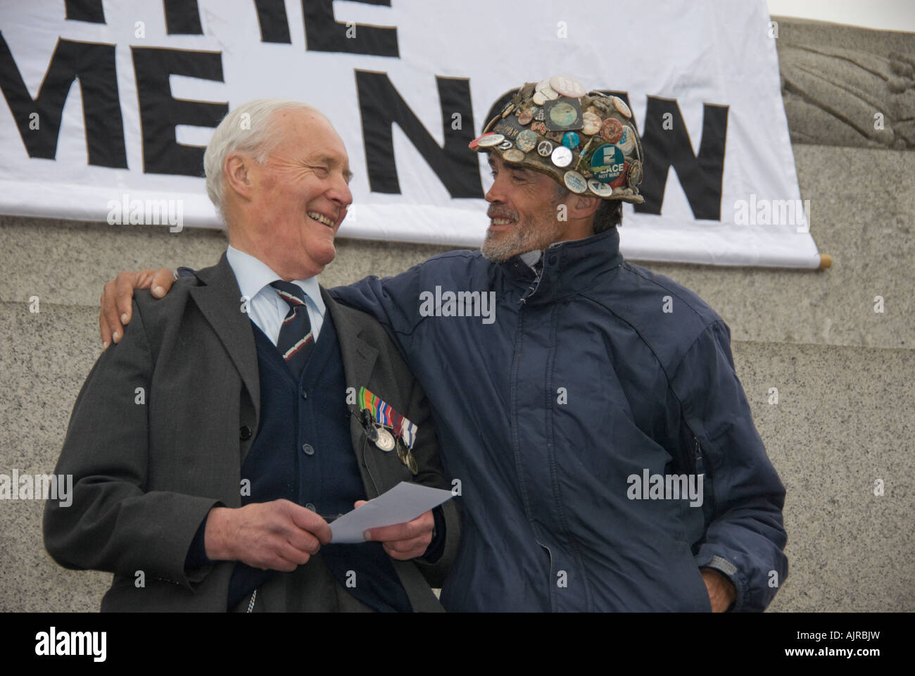 Brian Haw puts his arm round Tony Benn's shoulders on platform at ...