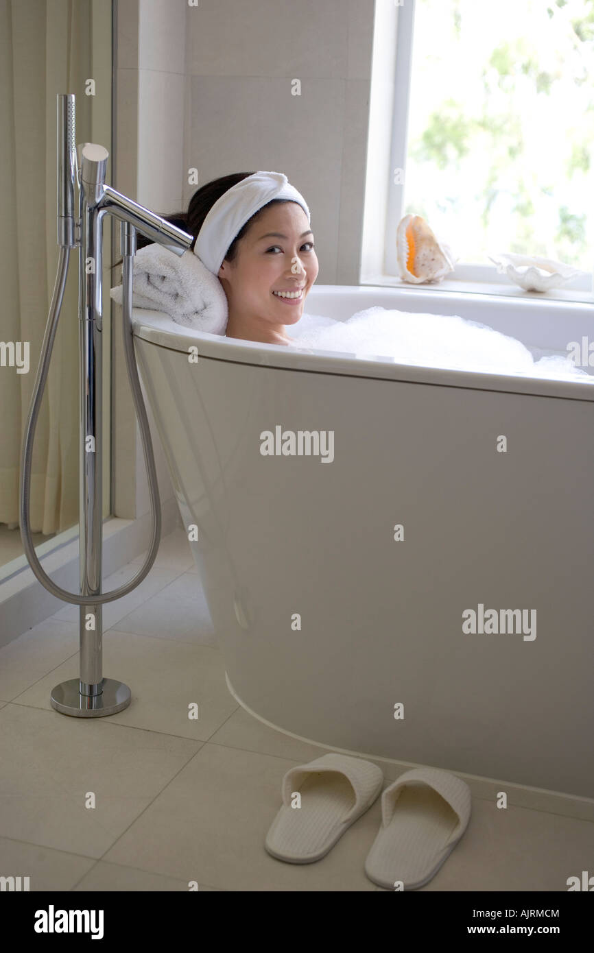 Woman taking a bubble bath hi-res stock photography and images - Alamy