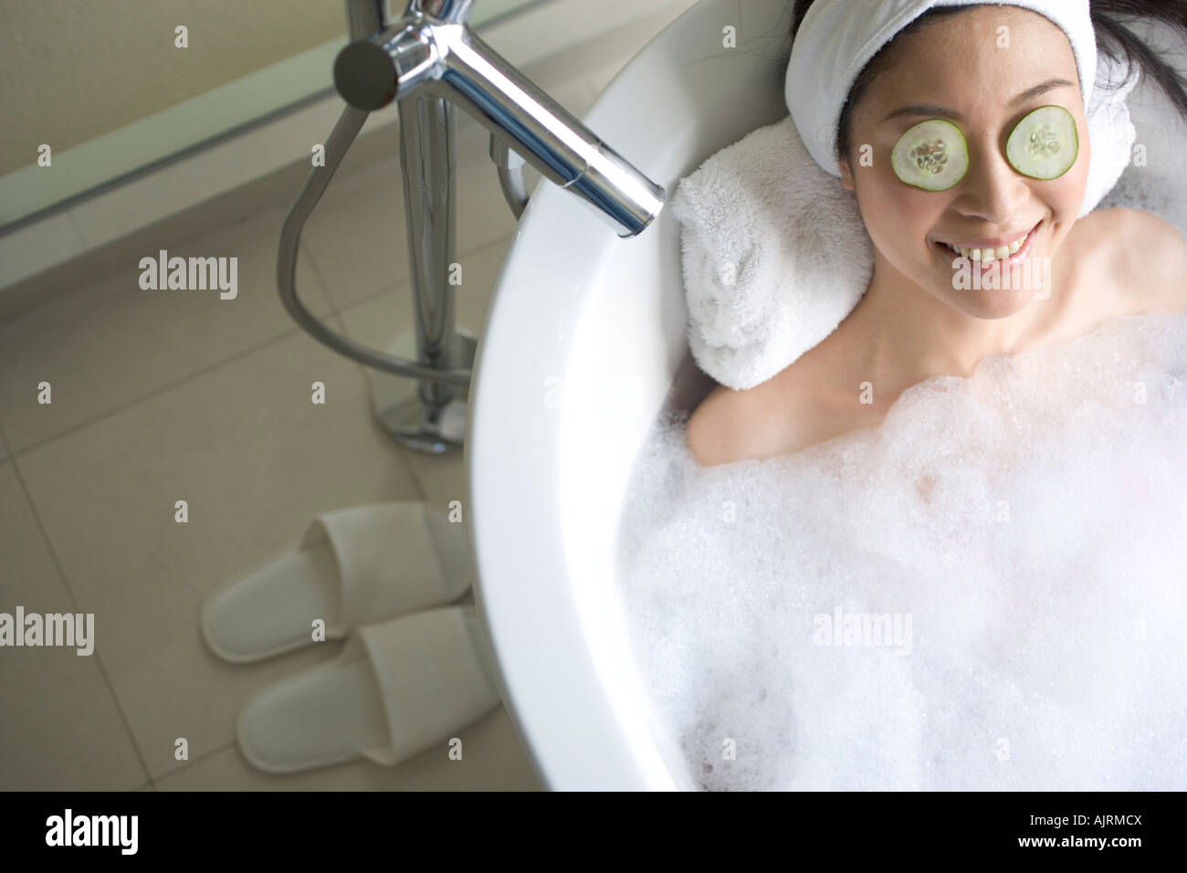 Young woman taking a bath Stock Photo - Alamy