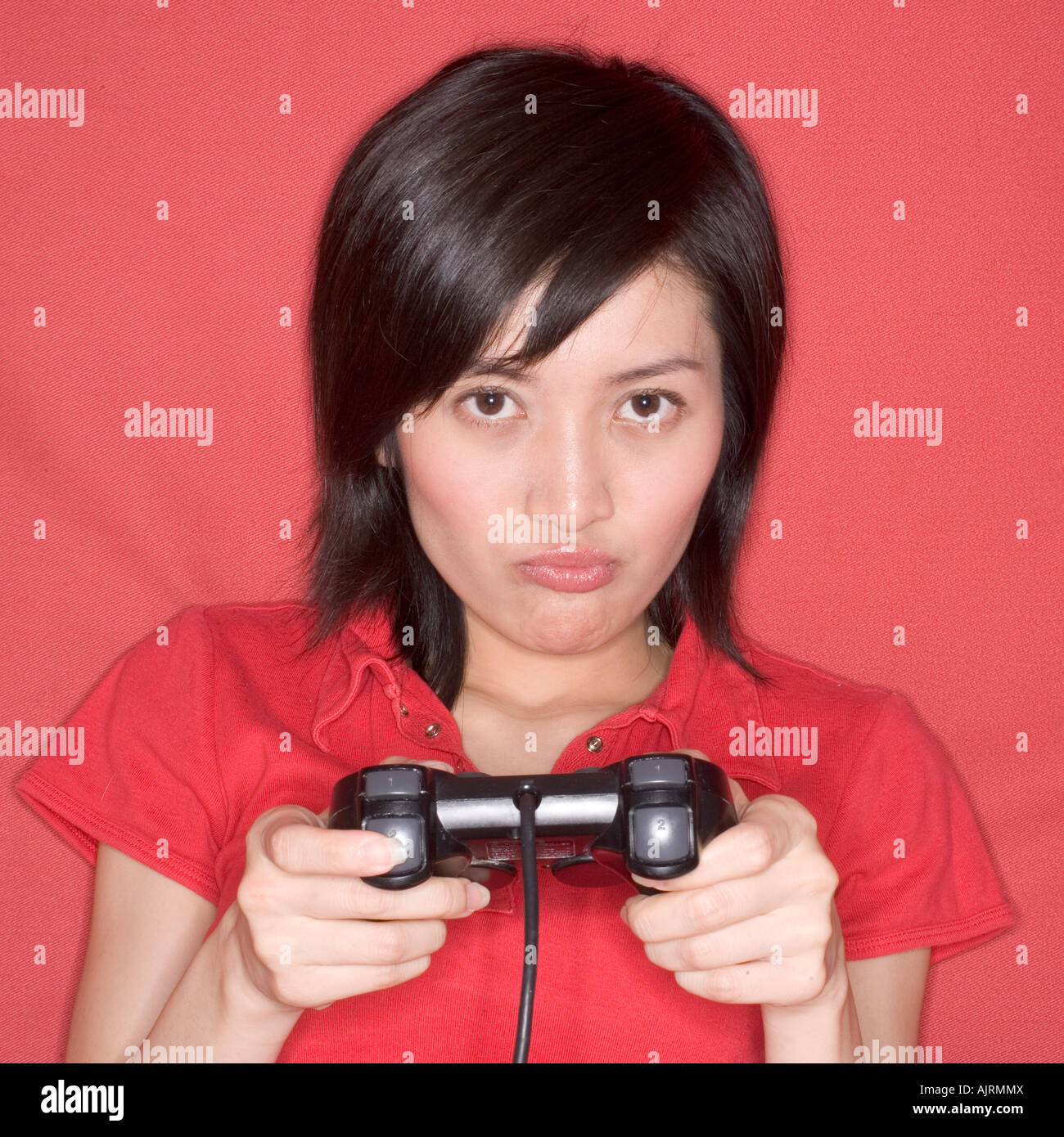 Young woman playing video game Stock Photo - Alamy