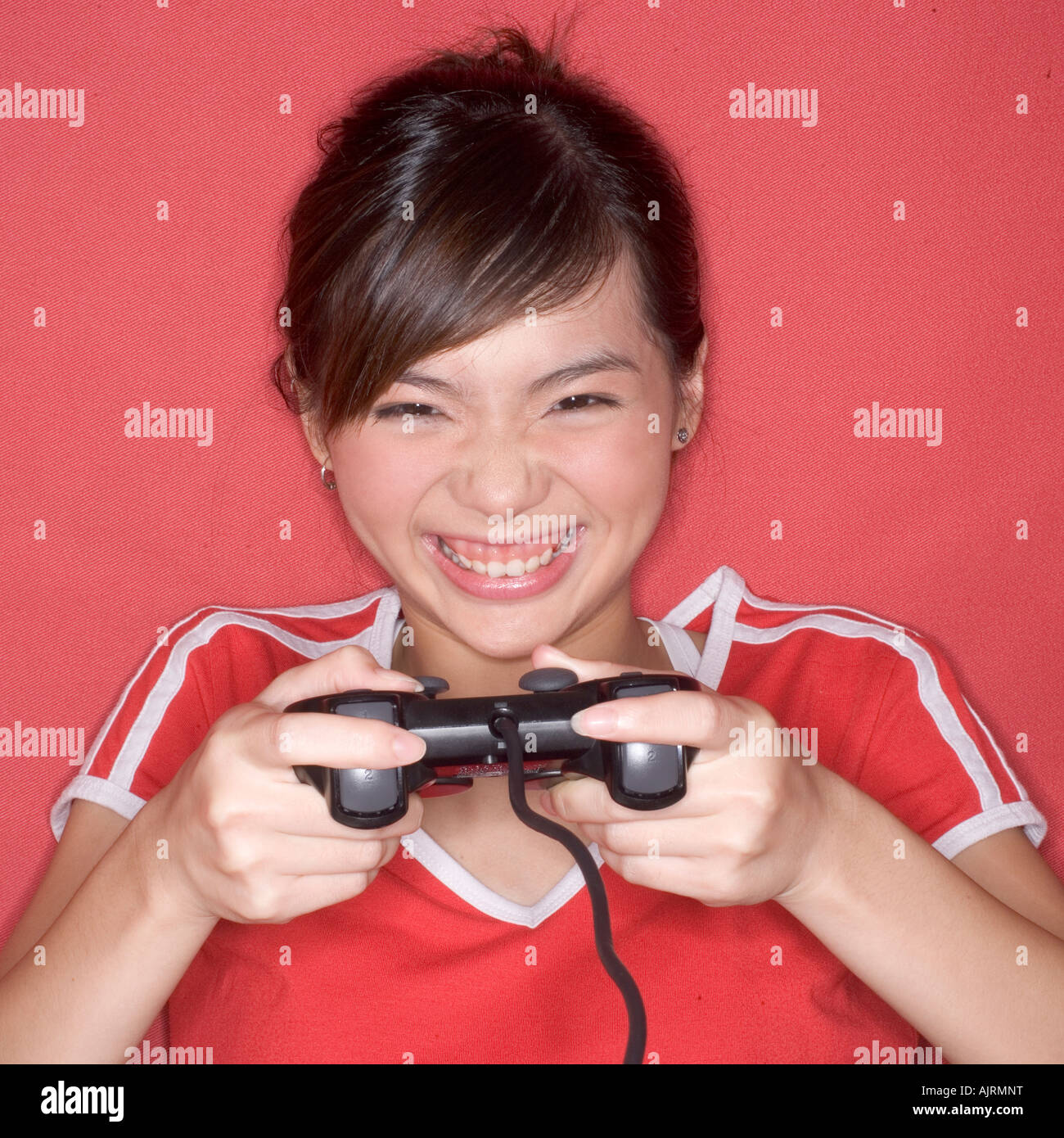 Young woman playing video game Stock Photo - Alamy