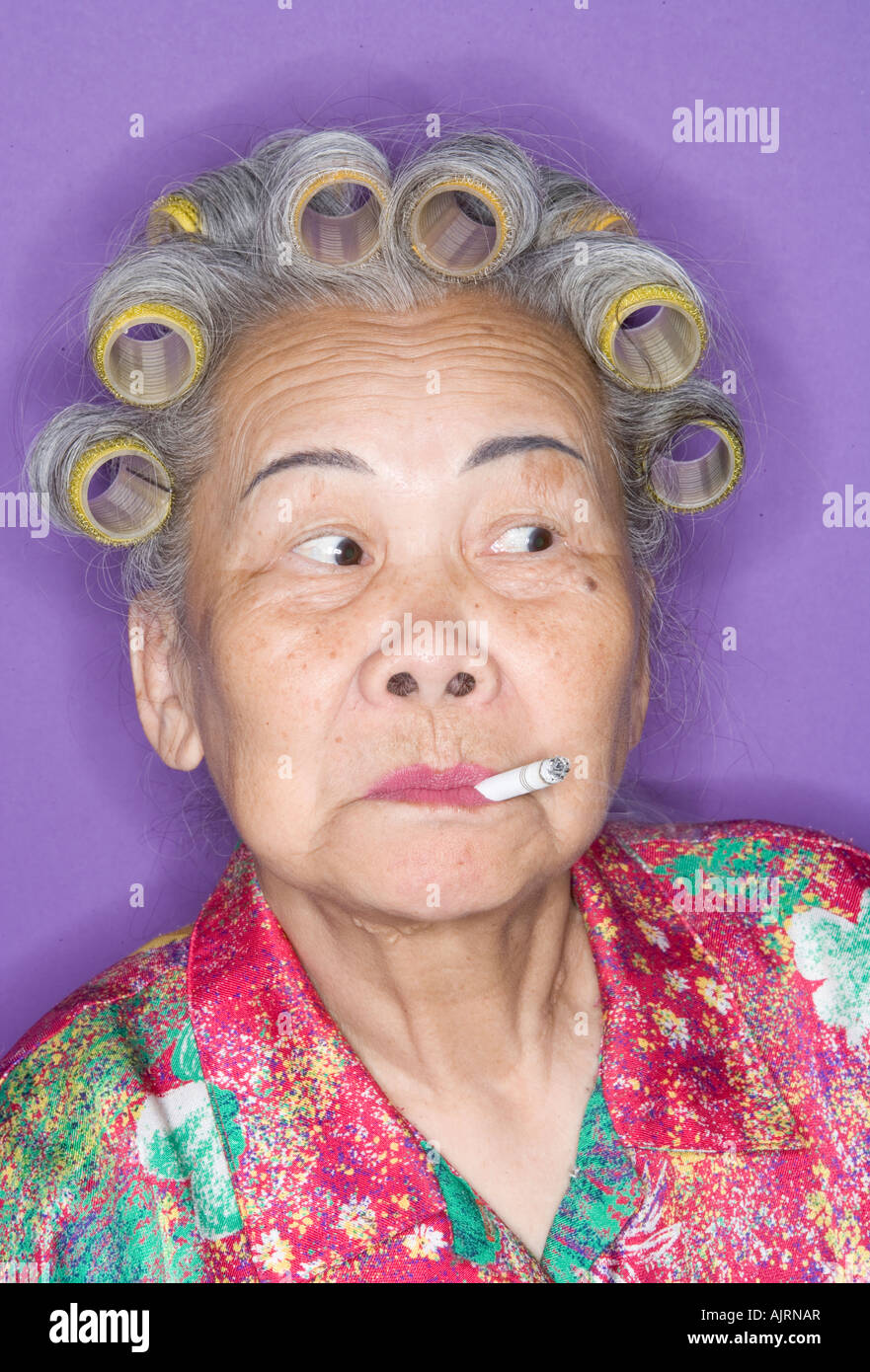 Portrait woman hair curlers smoking hi-res stock photography and images ...