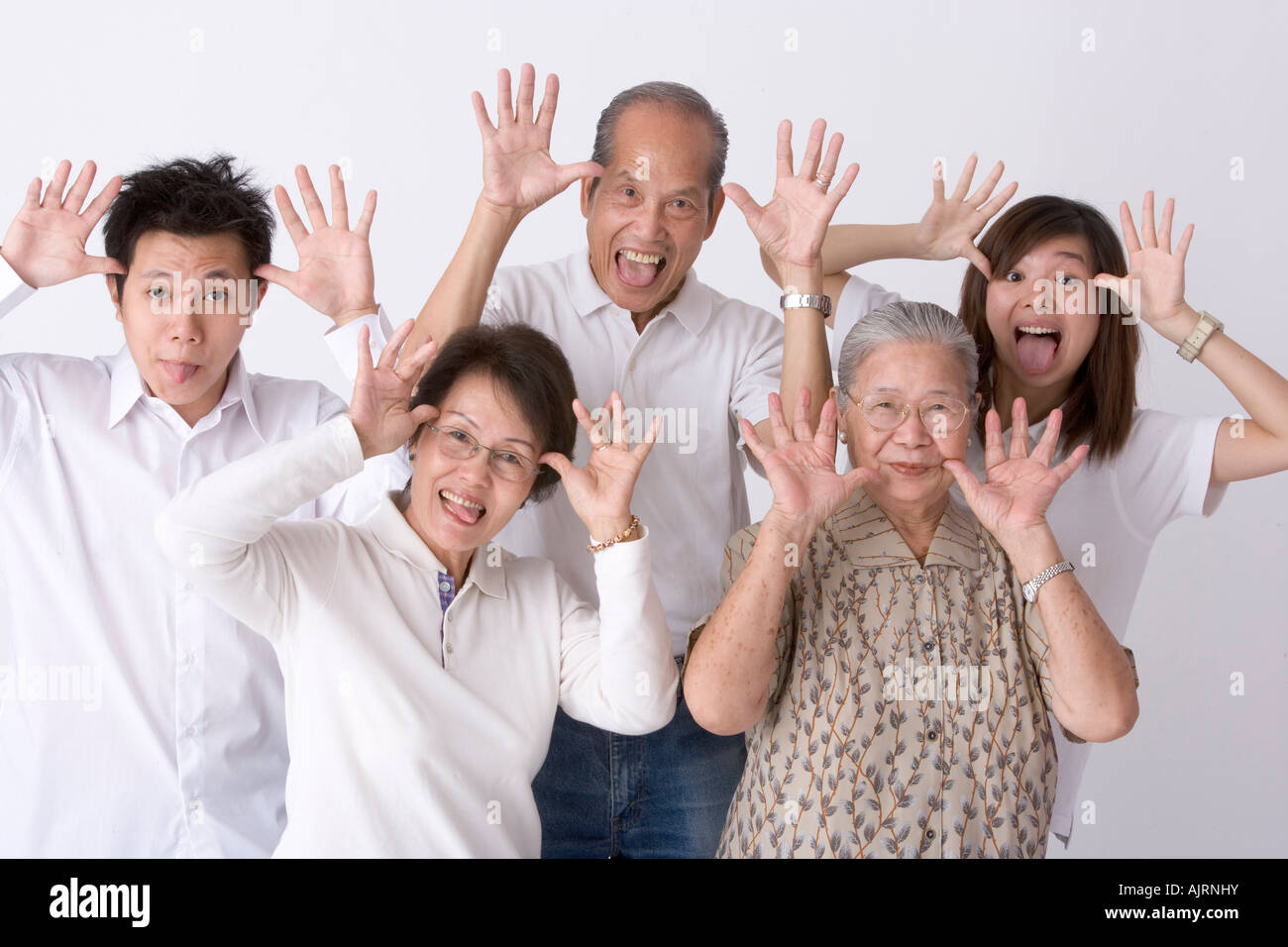 Portrait of a family making faces Stock Photo - Alamy