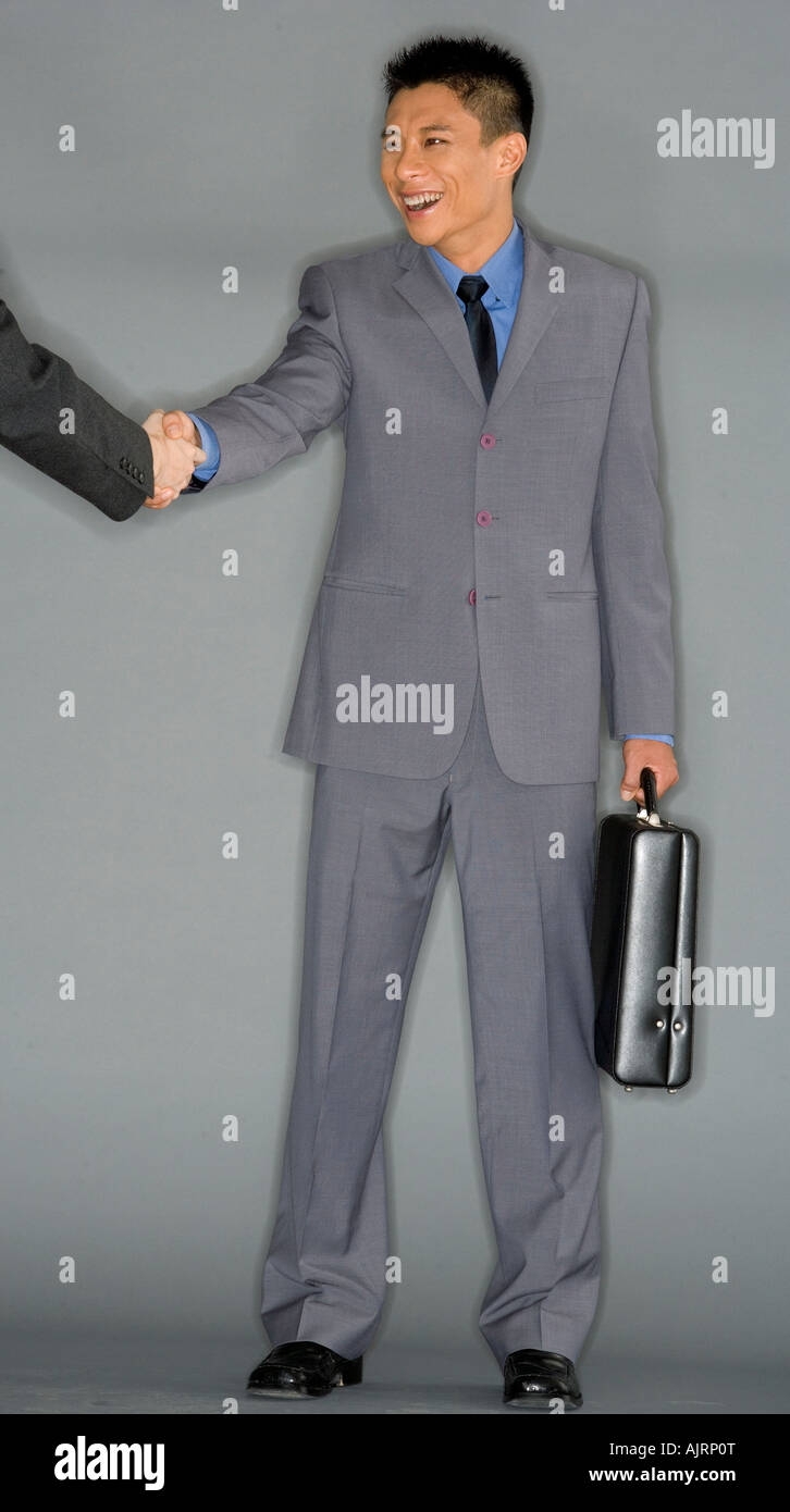 Portrait of businessmen shaking hands Stock Photo - Alamy