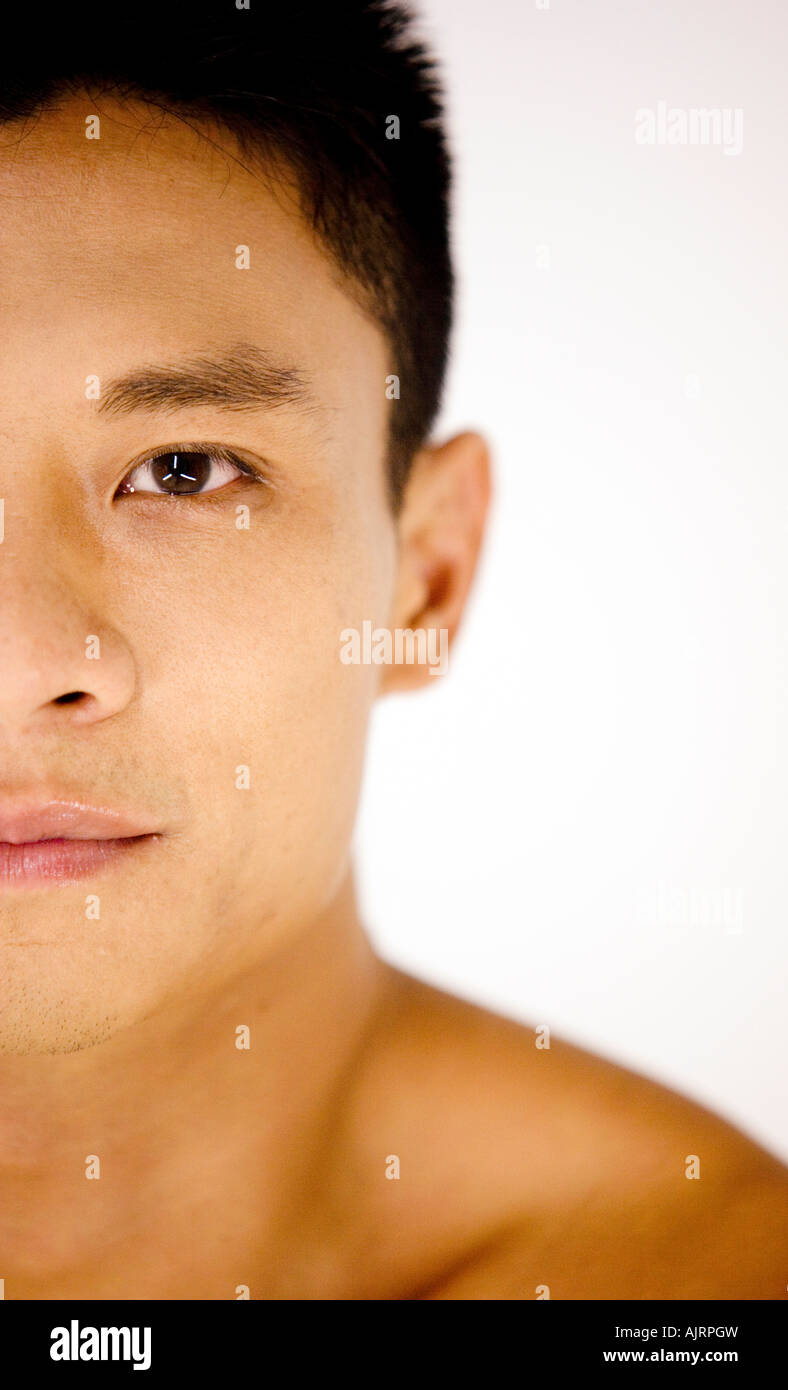 Portrait of a young man looking serious Stock Photo - Alamy