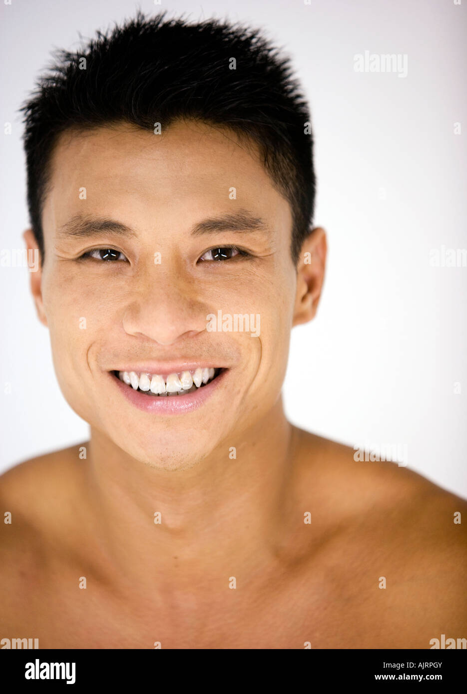 Portrait of a young man smiling Stock Photo - Alamy