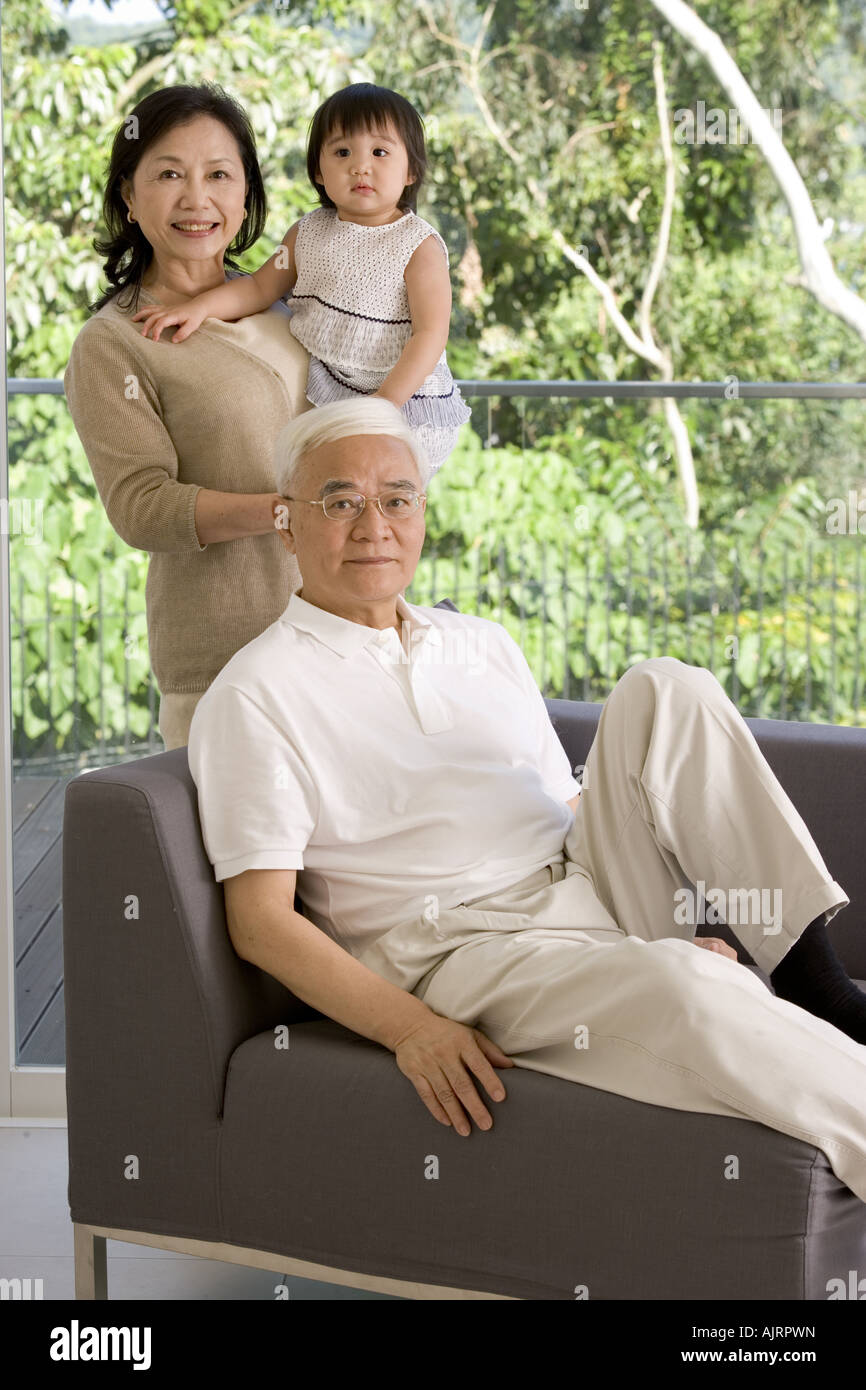 Portrait of grandparents and their granddaughter Stock Photo - Alamy